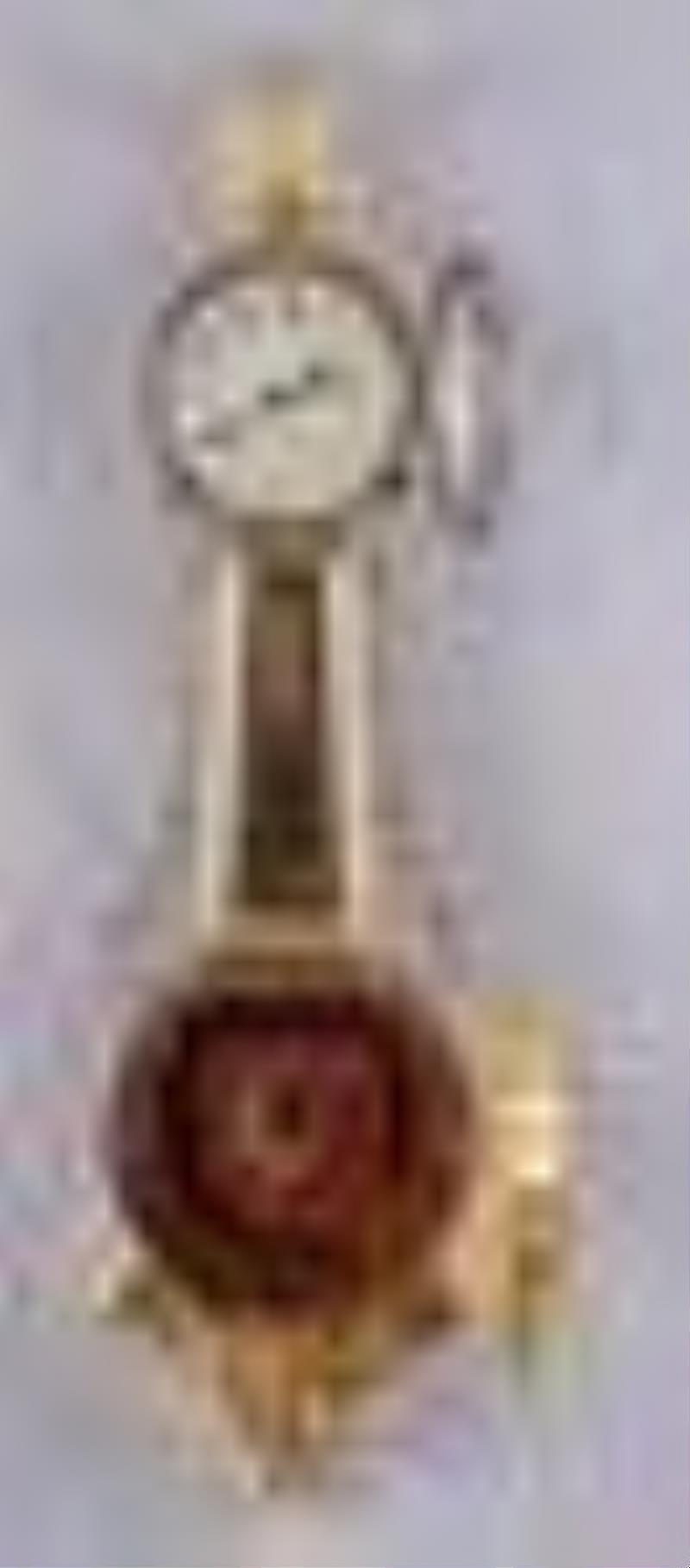 Foster Campos girandole wall clock.-ClockPrices.Com